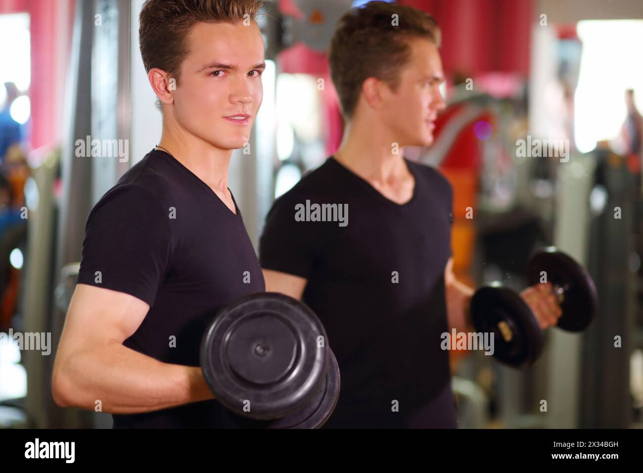 Young handsome man stands hi-res stock photography and images - Alamy