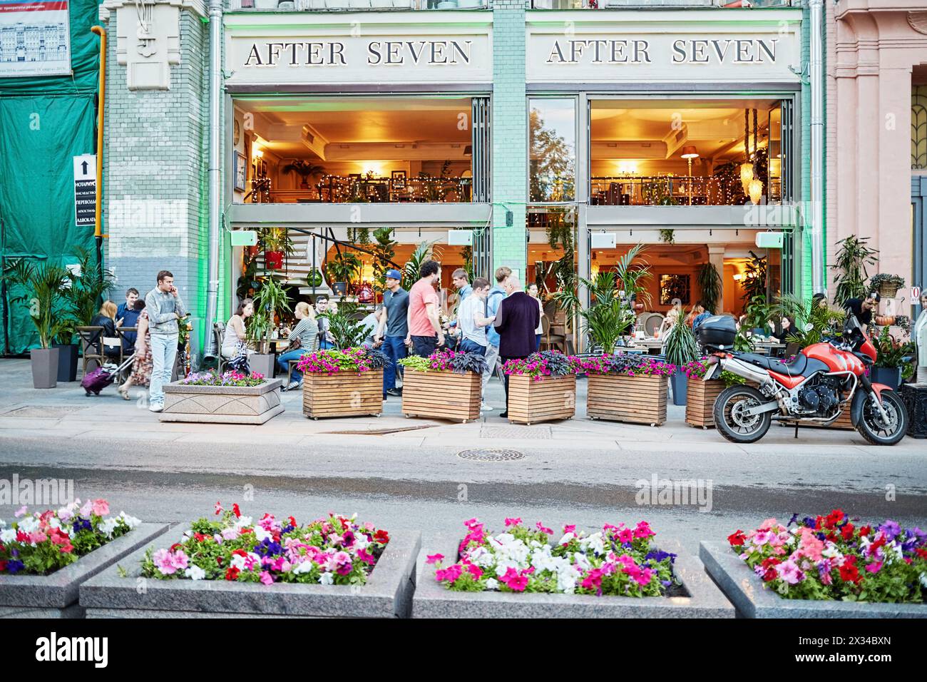 RUSSIA, MOSCOW - JUN 22, 2015: People against facade of After Seven ...