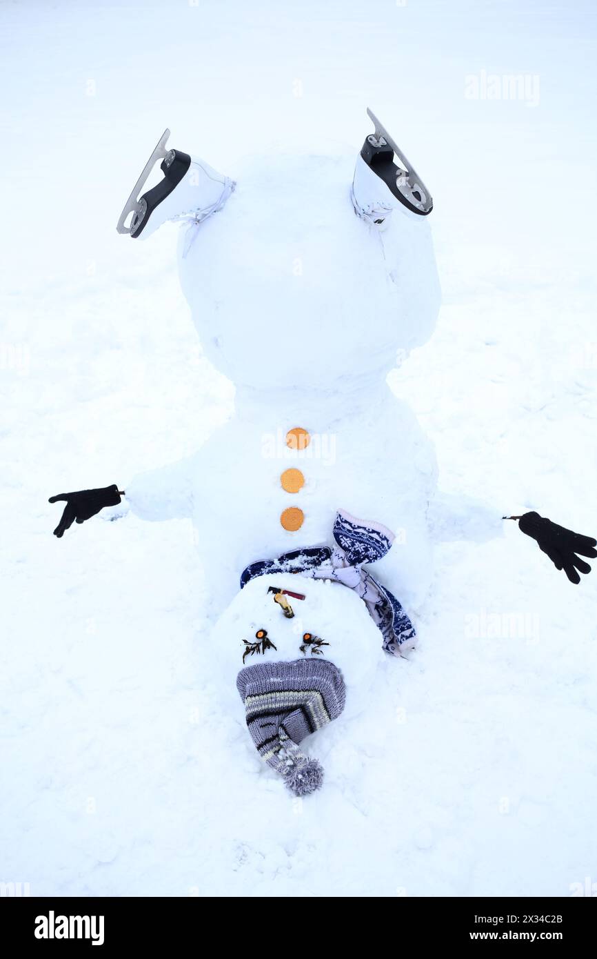 Upside down snowman with hat, scarf and skates at winter day Stock ...