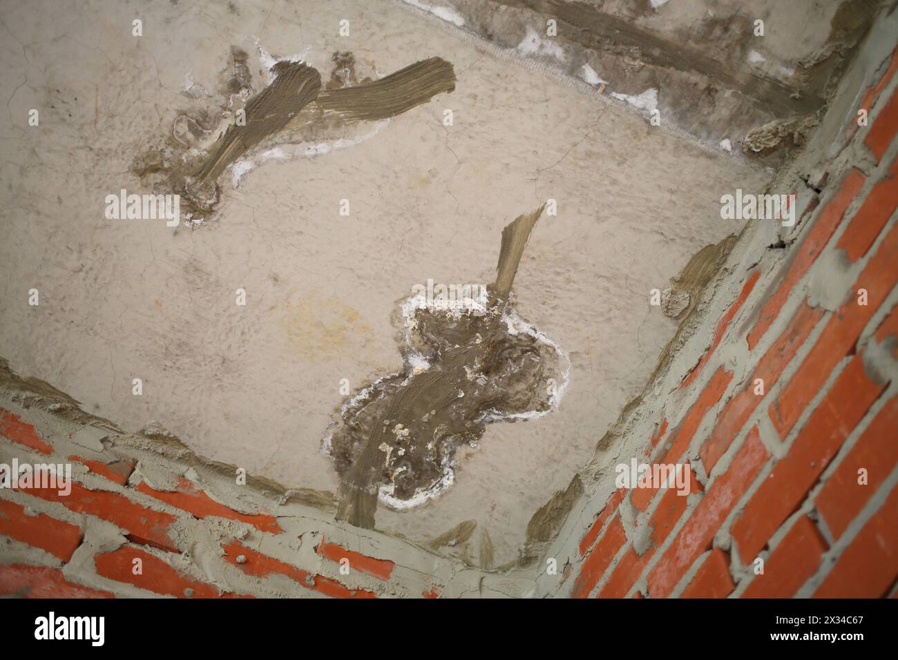 Daubed the cement cracks in the concrete slab Stock Photo - Alamy