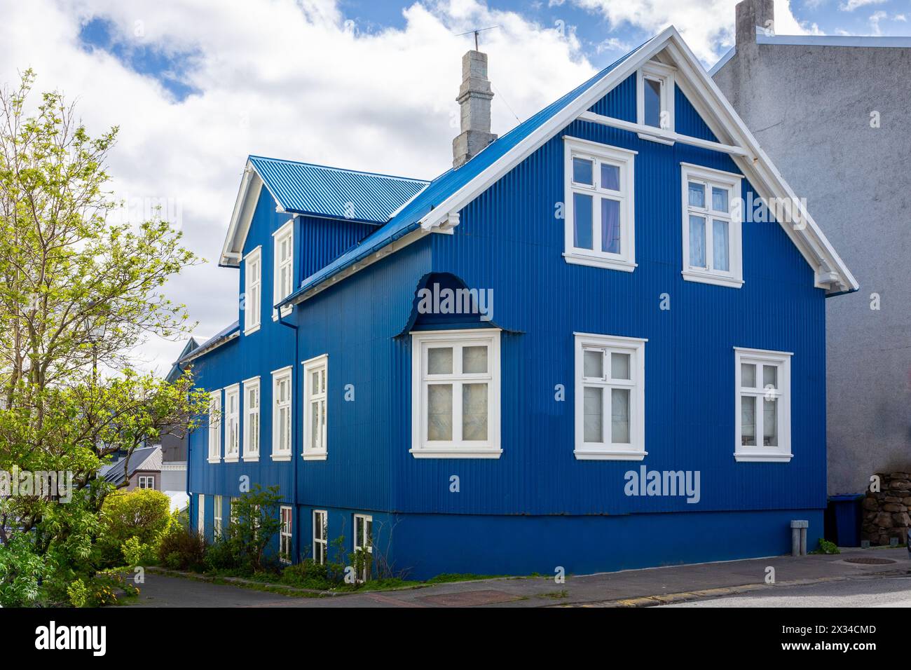 Traditional Icelandic blue residential house with gable roof, white ...