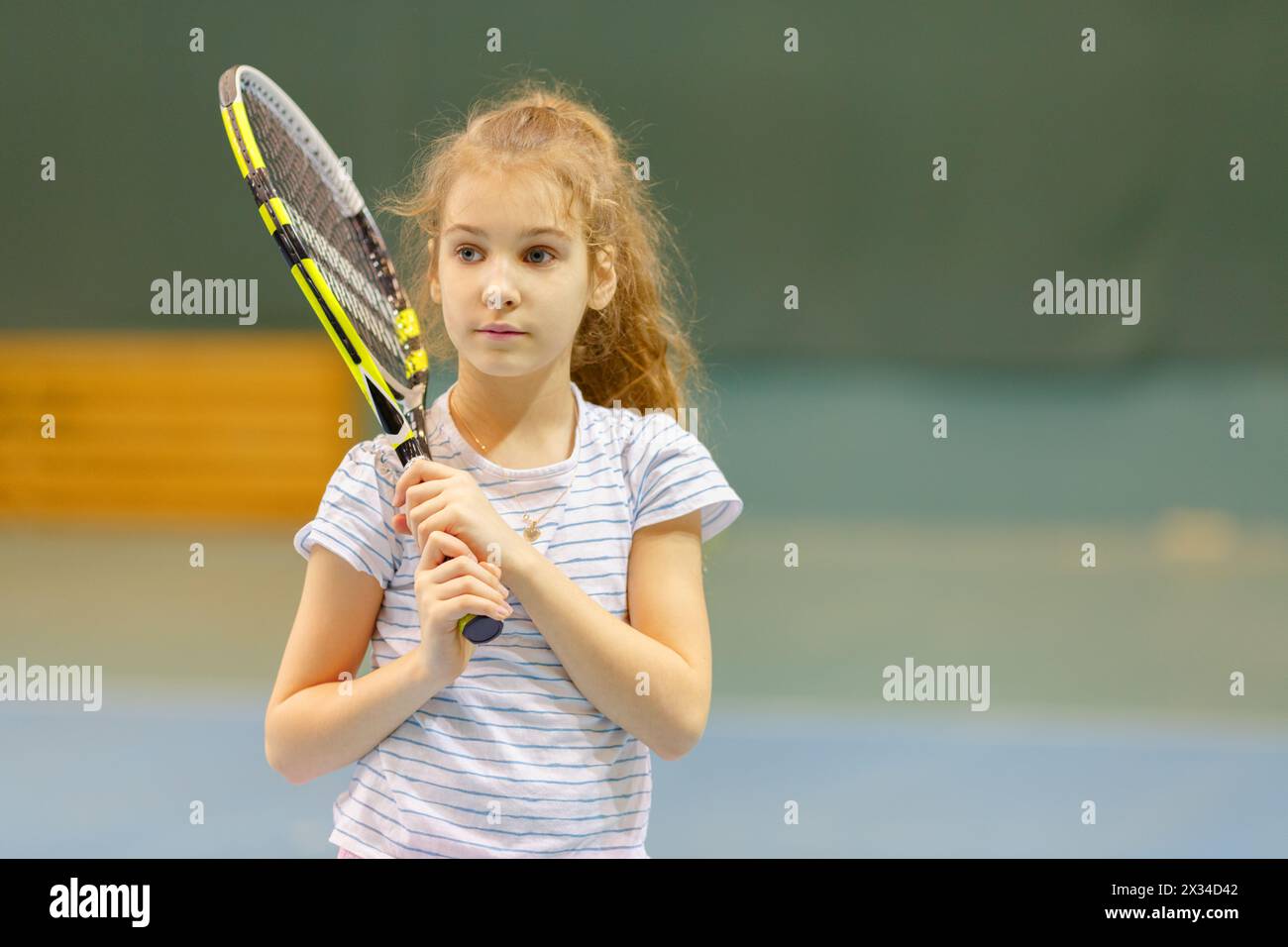 half portrait of young girl tennis player holding her racket Stock ...