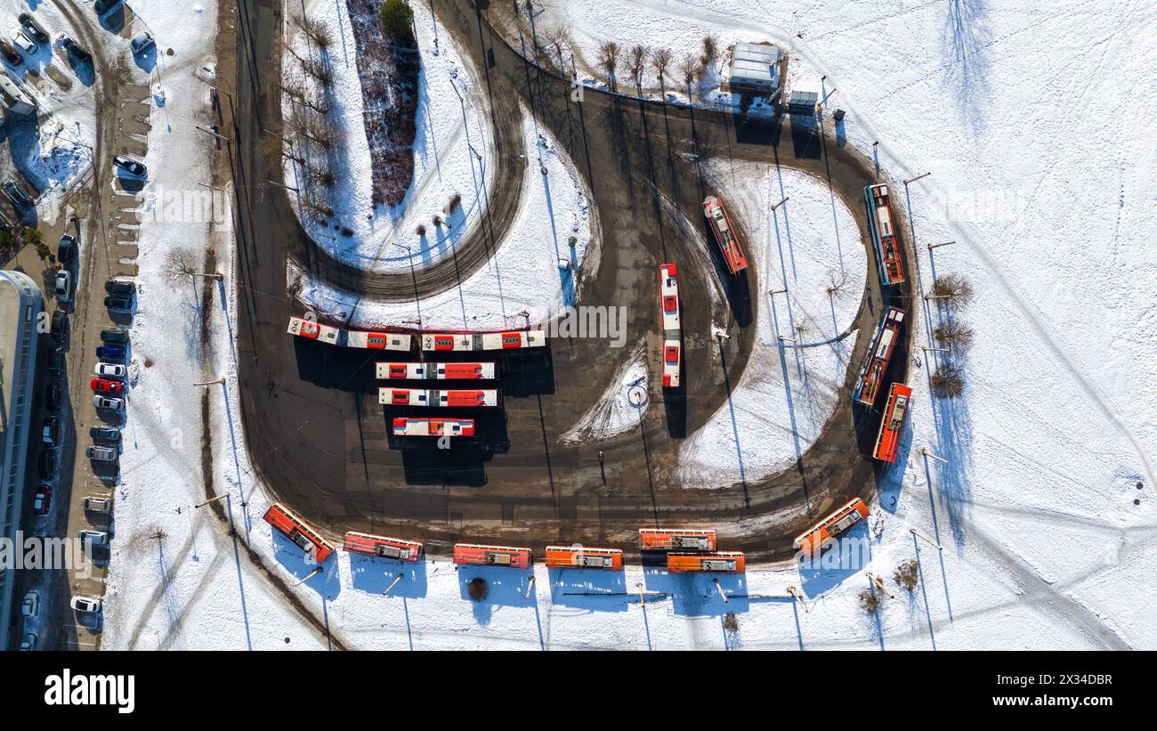 Drone photography of small terminal bus station with many parked buses ...