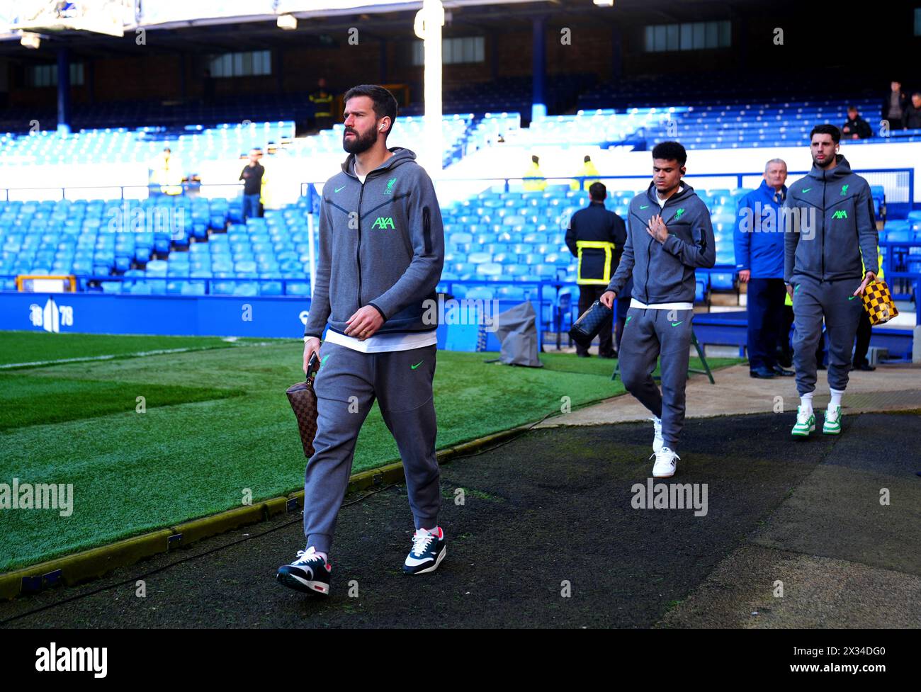 Liverpool goalkeeper Alisson Becker (left) arrives ahead of the Premier ...
