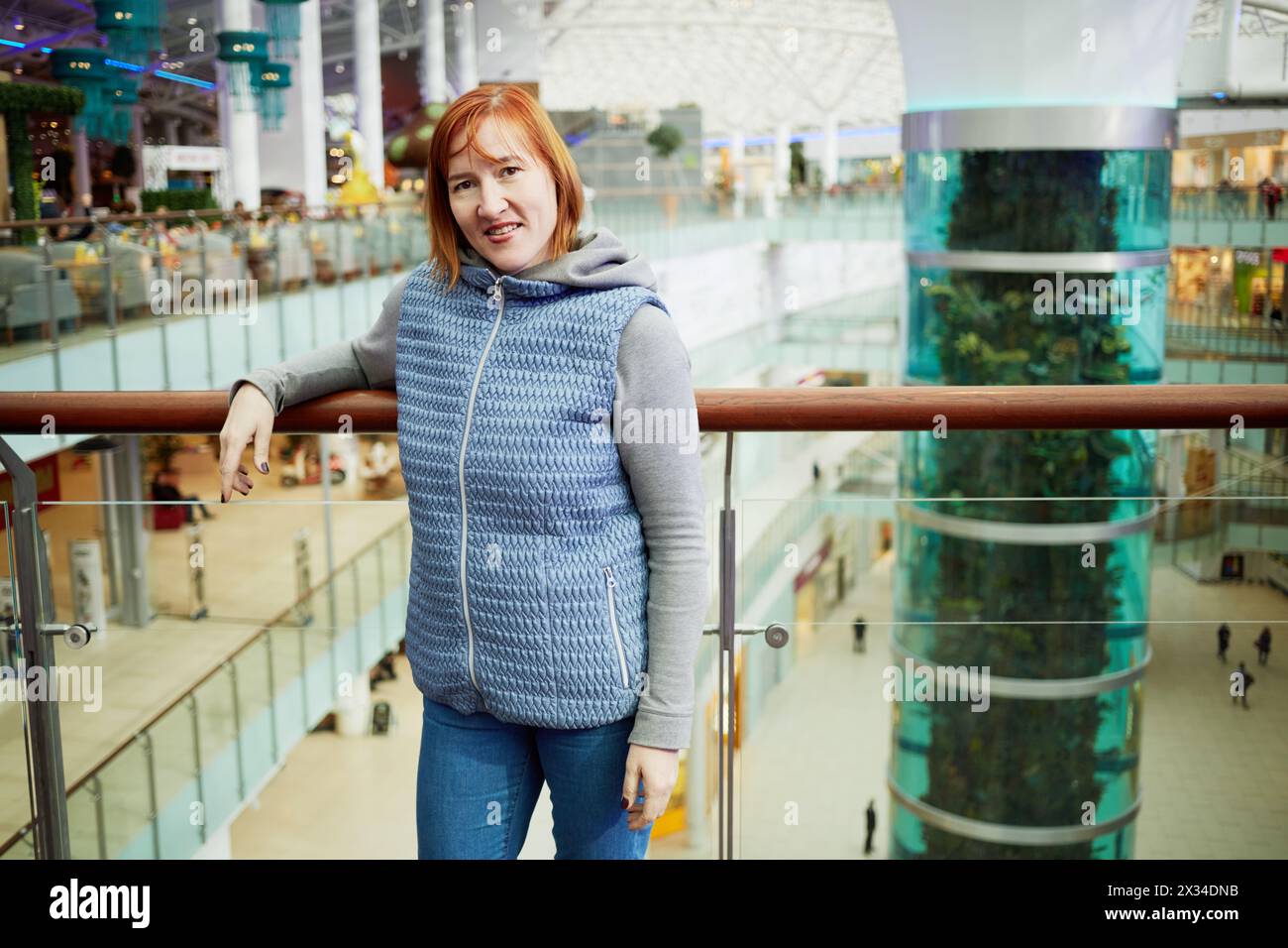 Woman stands glass railing hi-res stock photography and images - Alamy