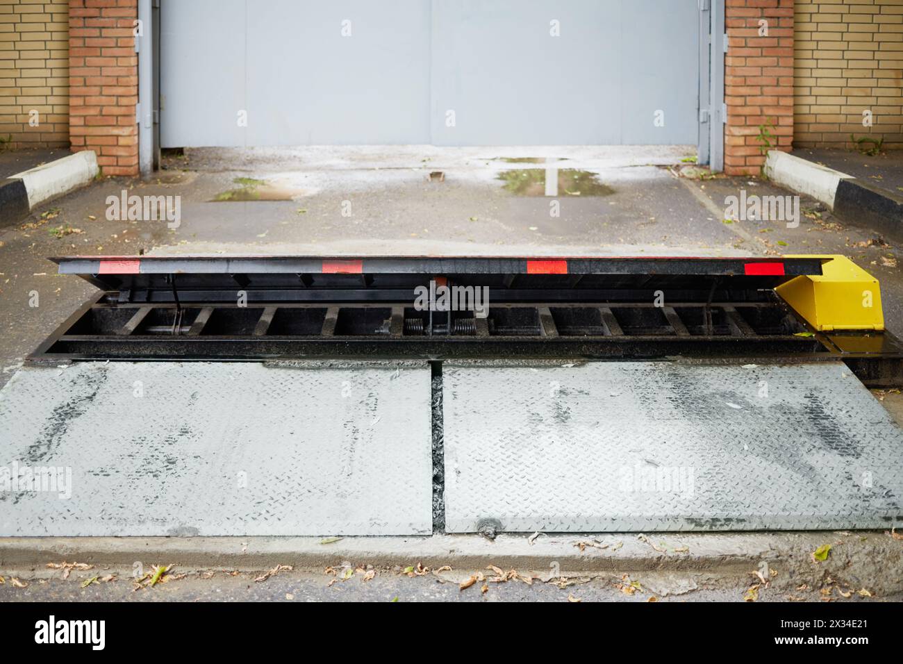 Car barrier (roadblock) in front of metal gate Stock Photo - Alamy