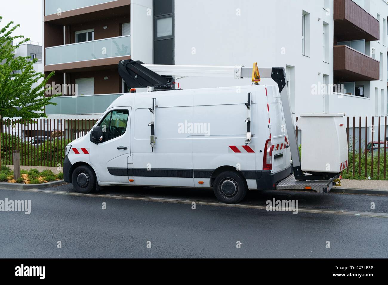 Bordeaux, France - April 26, 2023: A white van is parked on the side of ...