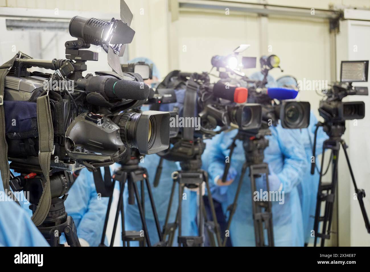 Cameras and cameramen in shop floor Stock Photo - Alamy
