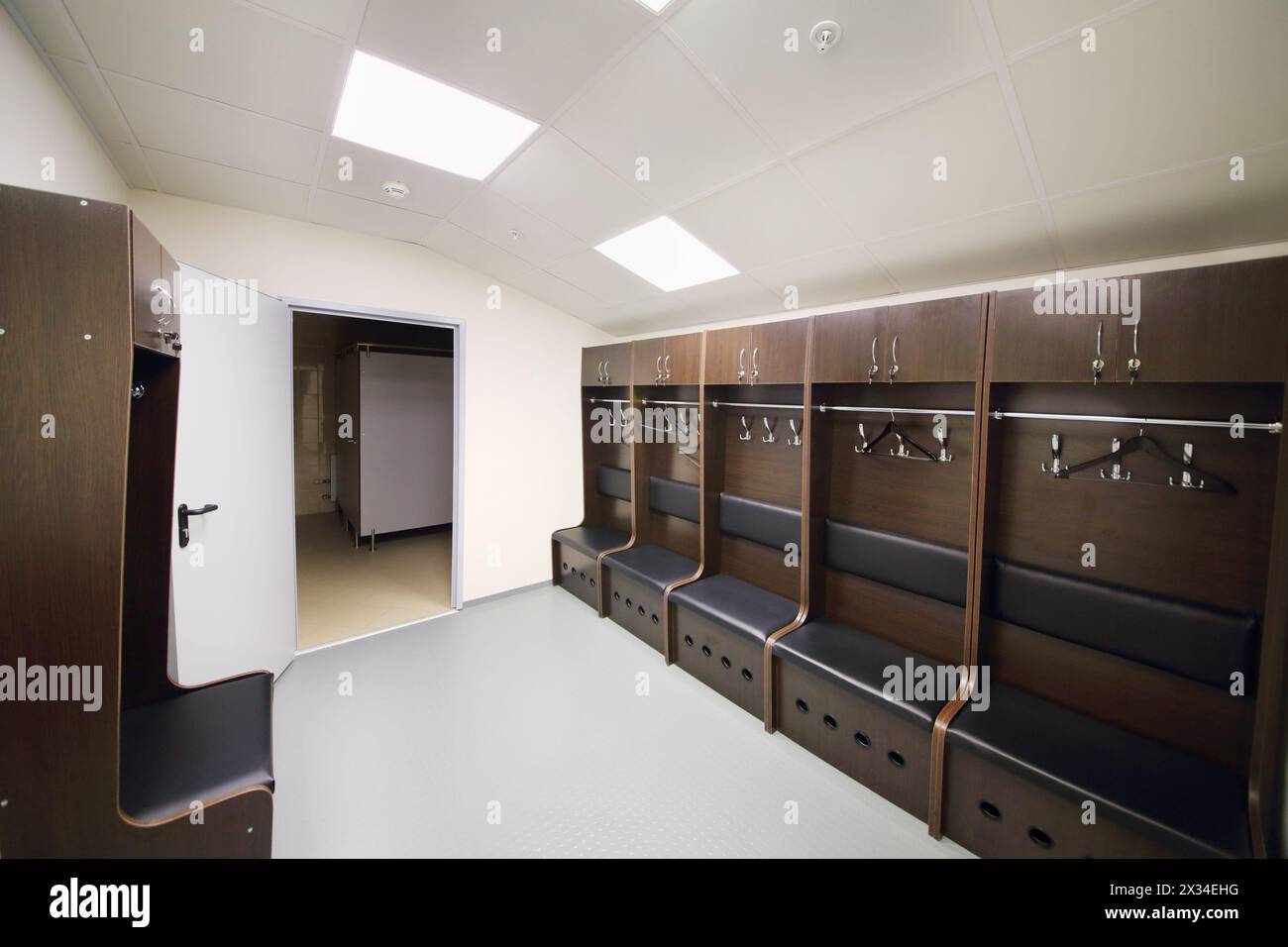 Empty room for sports judges in stadium - lockers and hangers for ...