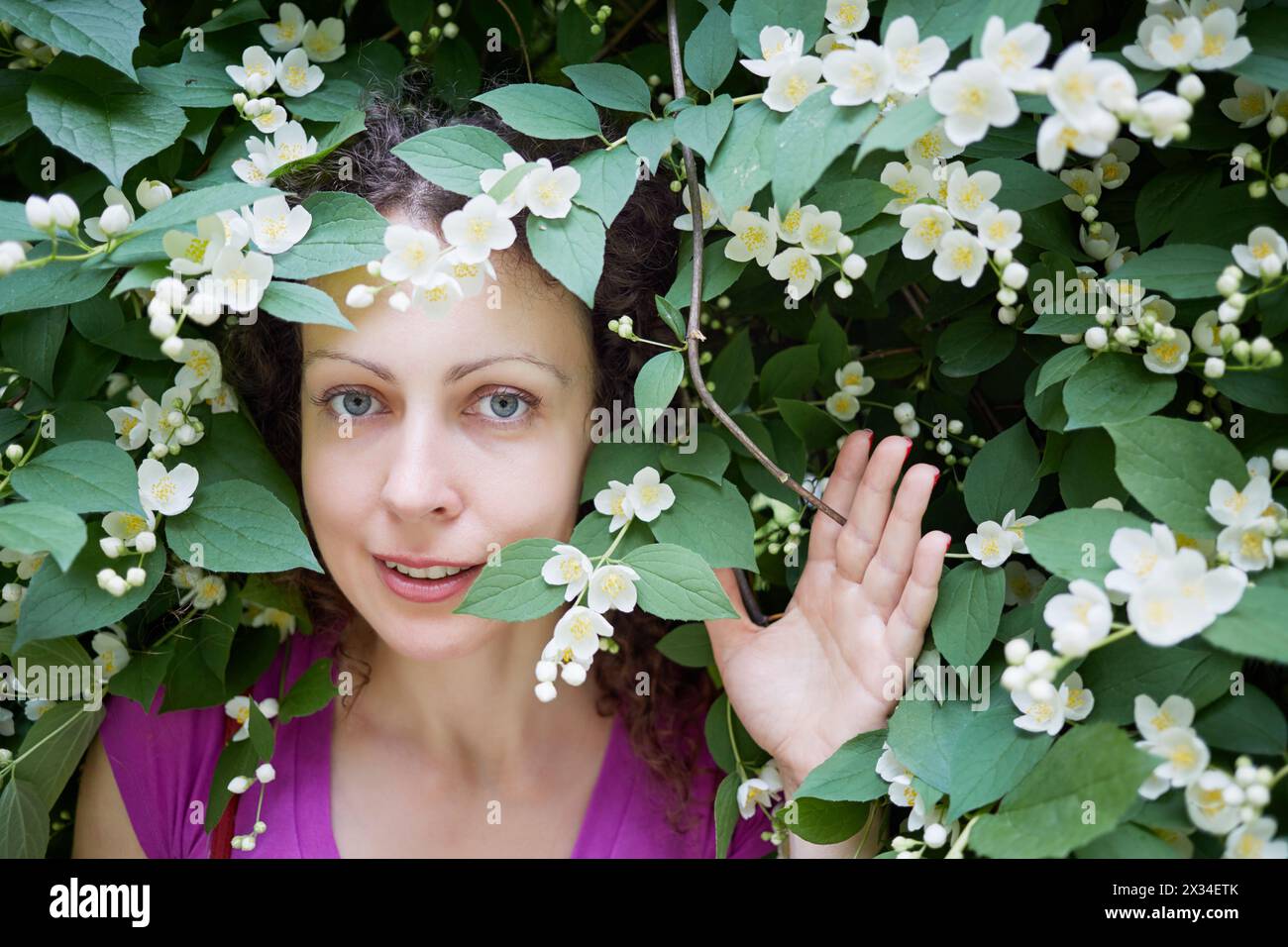 Woman looks blossom tree hi-res stock photography and images - Alamy