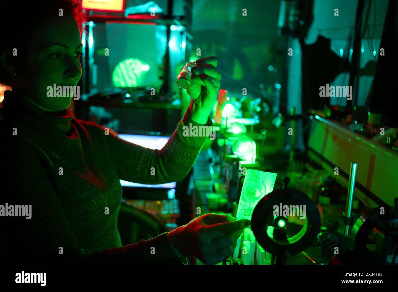 Scientist engaged in research in lab show movement of microparticles by ...