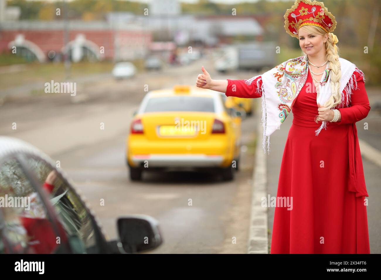 Woman in traditional russian clothes and kokoshnik with long braid ...