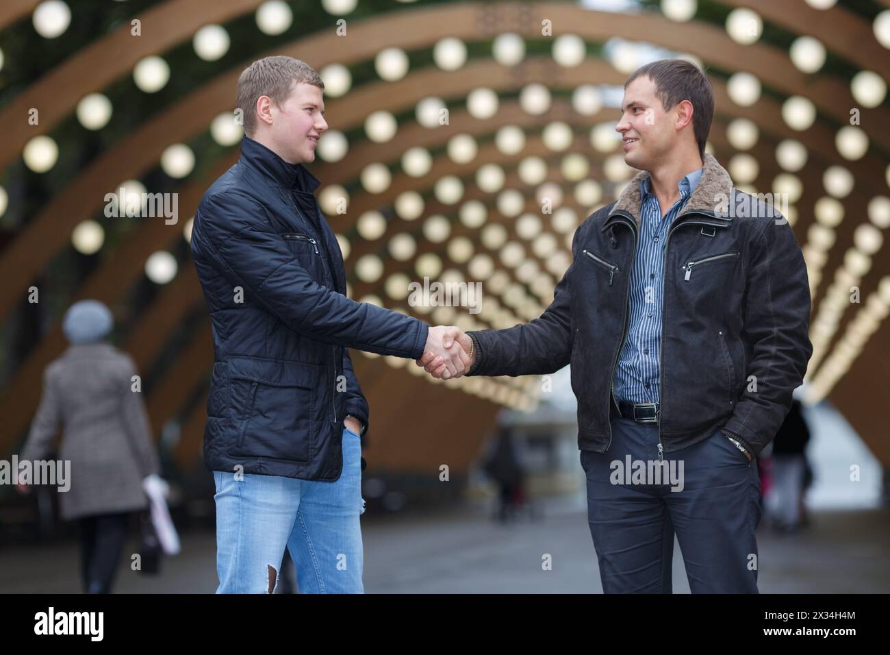 portrait of two friends on background of lights installation main park ...