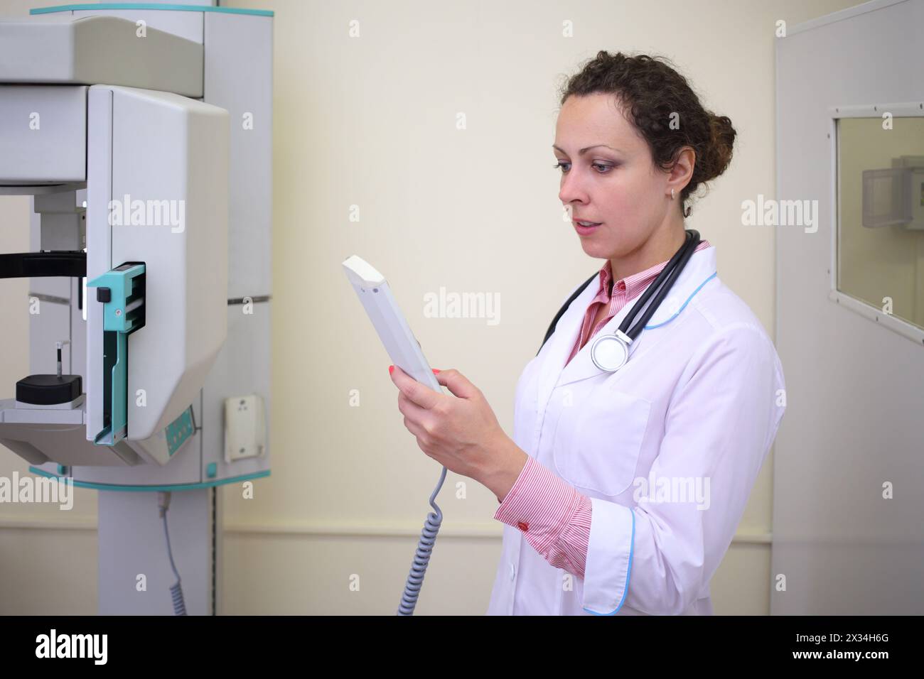 Medical worker uses orthopantomograph in the examination of the patient ...