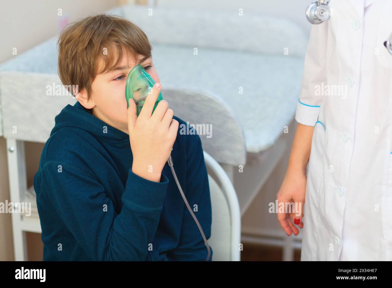 Young boy and nurse making inhalation with nebuliser in exam room Stock ...