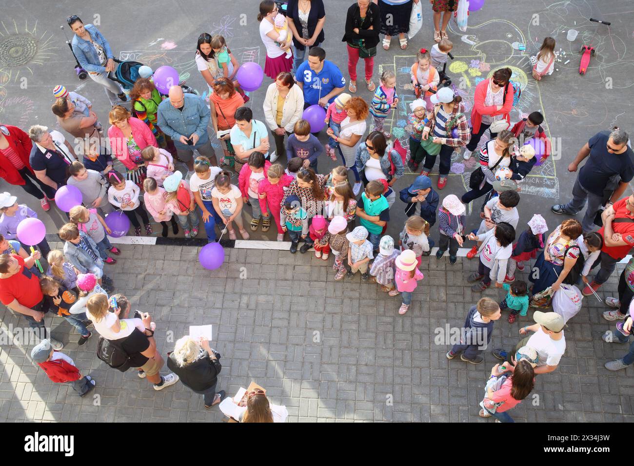 MOSCOW - JUN 01, 2015: Adults and children in the summing up the ...