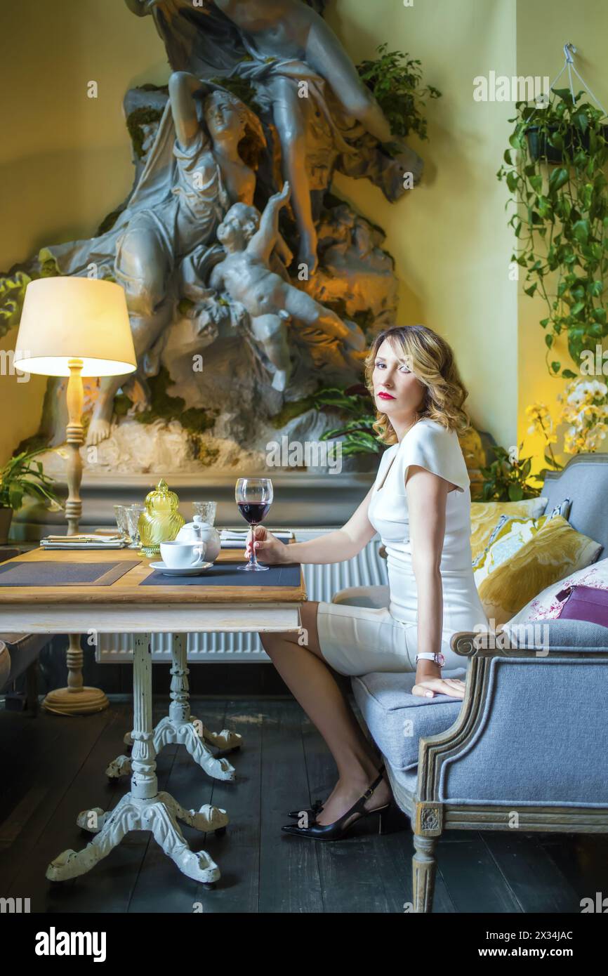 MOSCOW, RUSSIA - JUL 12, 2015: Woman in white dress (with model release ...