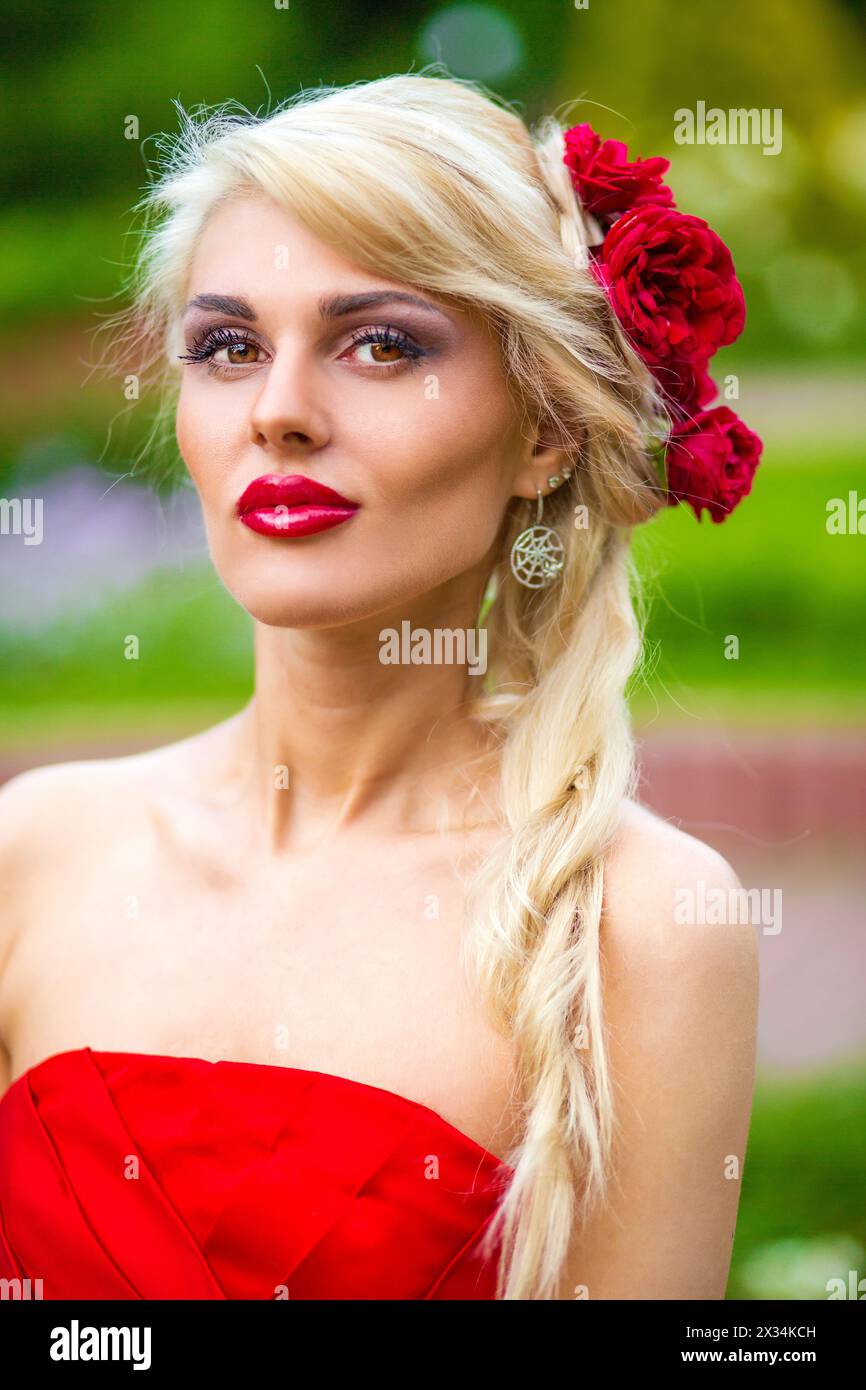 half length portrait of beautiful pretty woman in red dress in summer ...