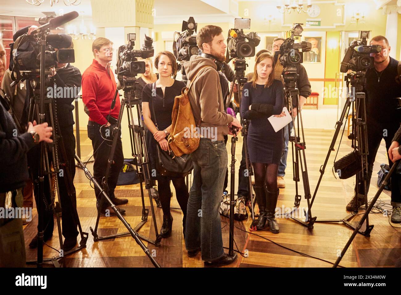 MOSCOW, RUSSIA - JAN 15, 2015: Journalists and cameramen stand in foyer ...