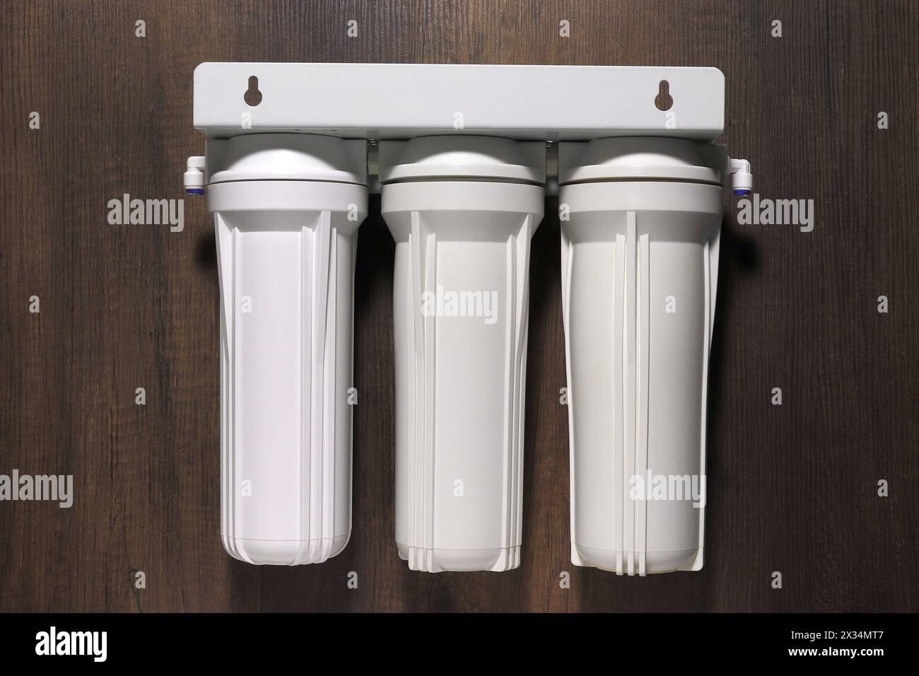 Image of a device containing three stages of water purification at home ...