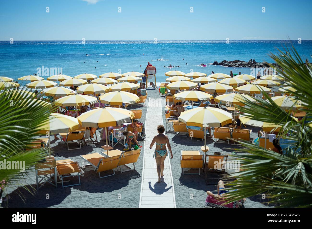LIGURIA, ITALY - AUG 06, 2016: People on coastline beach. Ligurian ...
