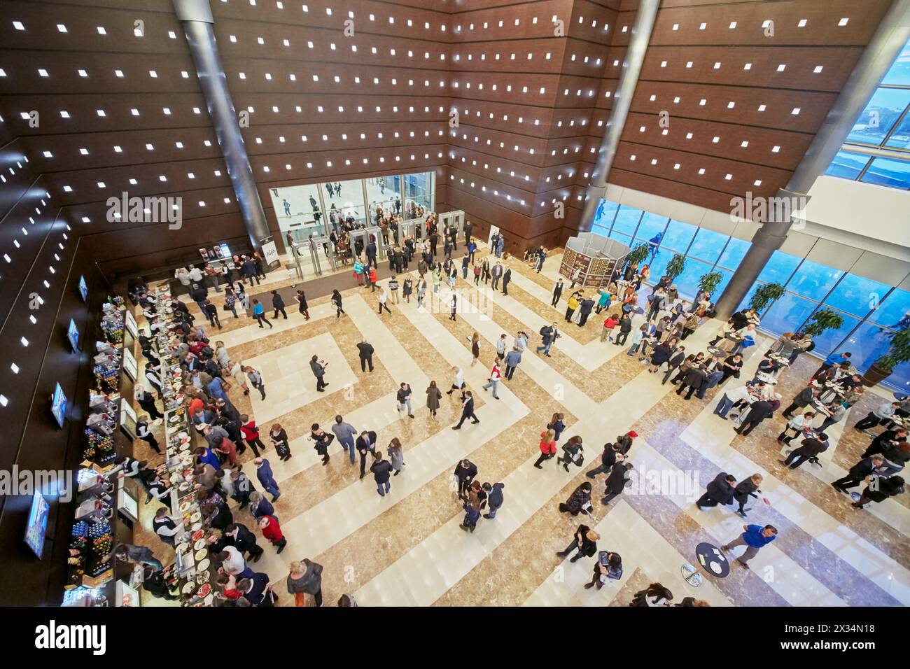 MOSCOW, RUSSIA - APR 24, 2015: People in cafeteria in lobby of Crocus ...