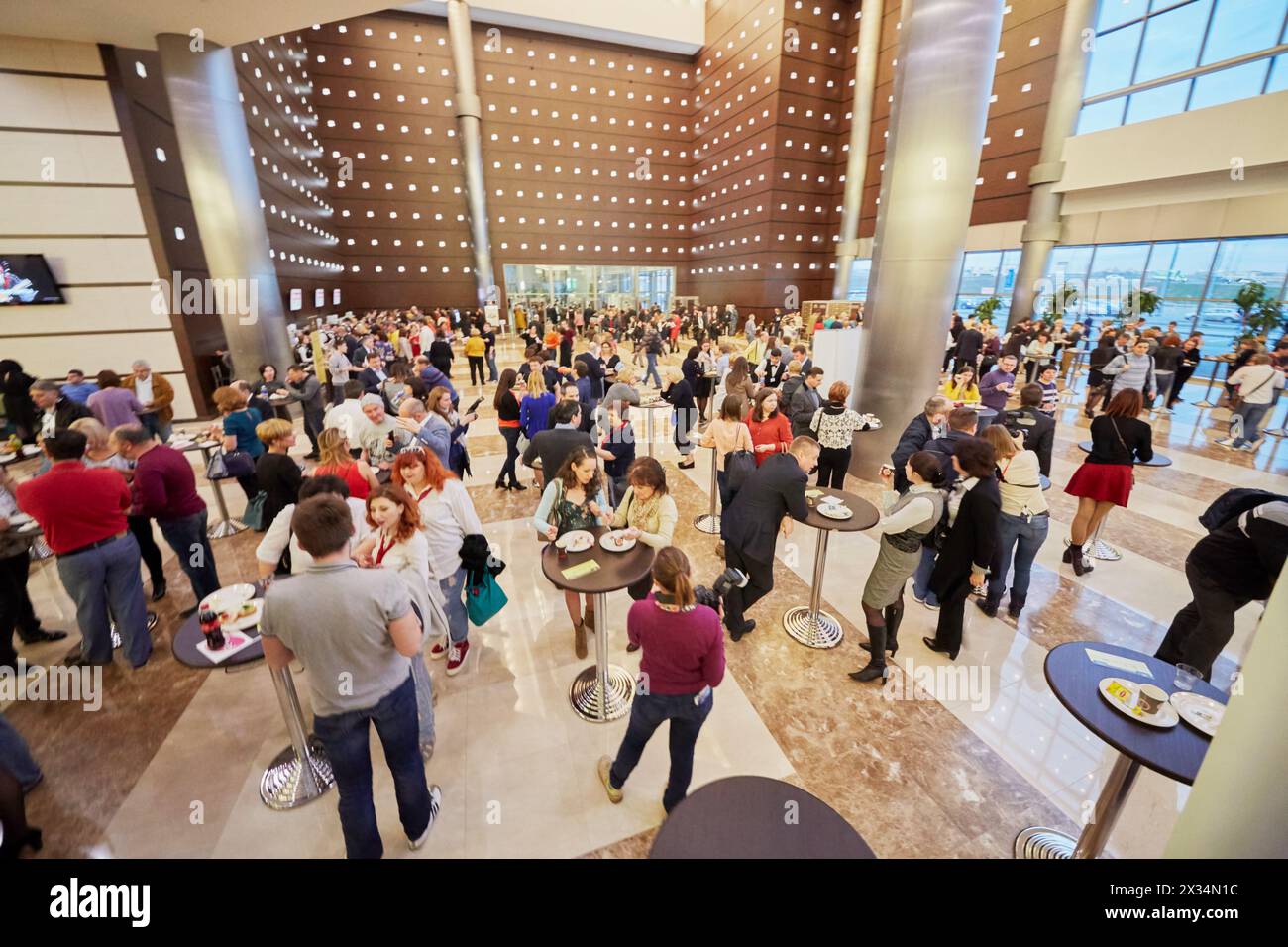 MOSCOW, RUSSIA - APR 24, 2015: People in cafeteria of Crocus city hall ...