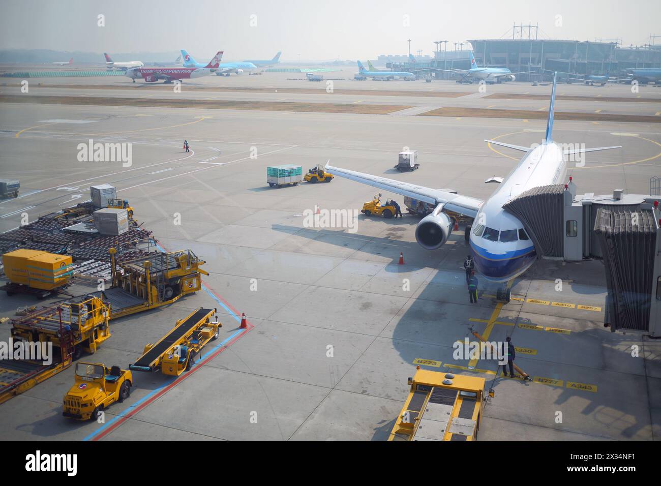 SEOUL - NOV 05, 2015: Several planes on runway and terminals of Incheon ...