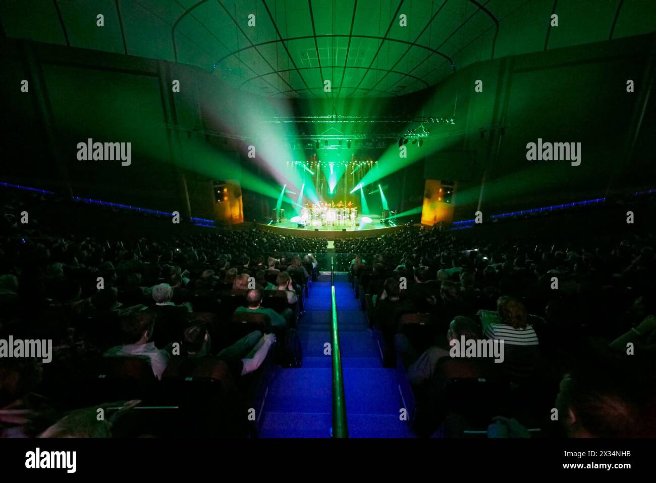 Auditorium with spectators and stage with musicians during concert ...