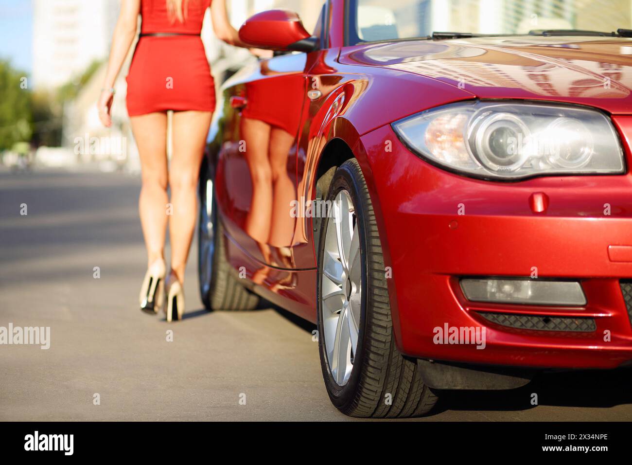 MOSCOW - SEP 13, 2015: Woman (with model release) goes near BMW ...
