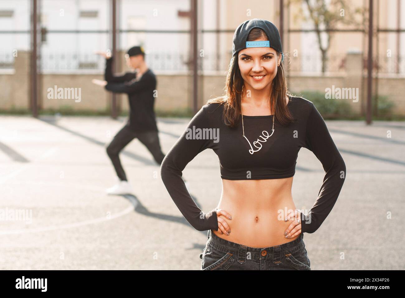 Hip-hop Dancer Woman In Stylish Black Dress With Chain "Loves" And A ...