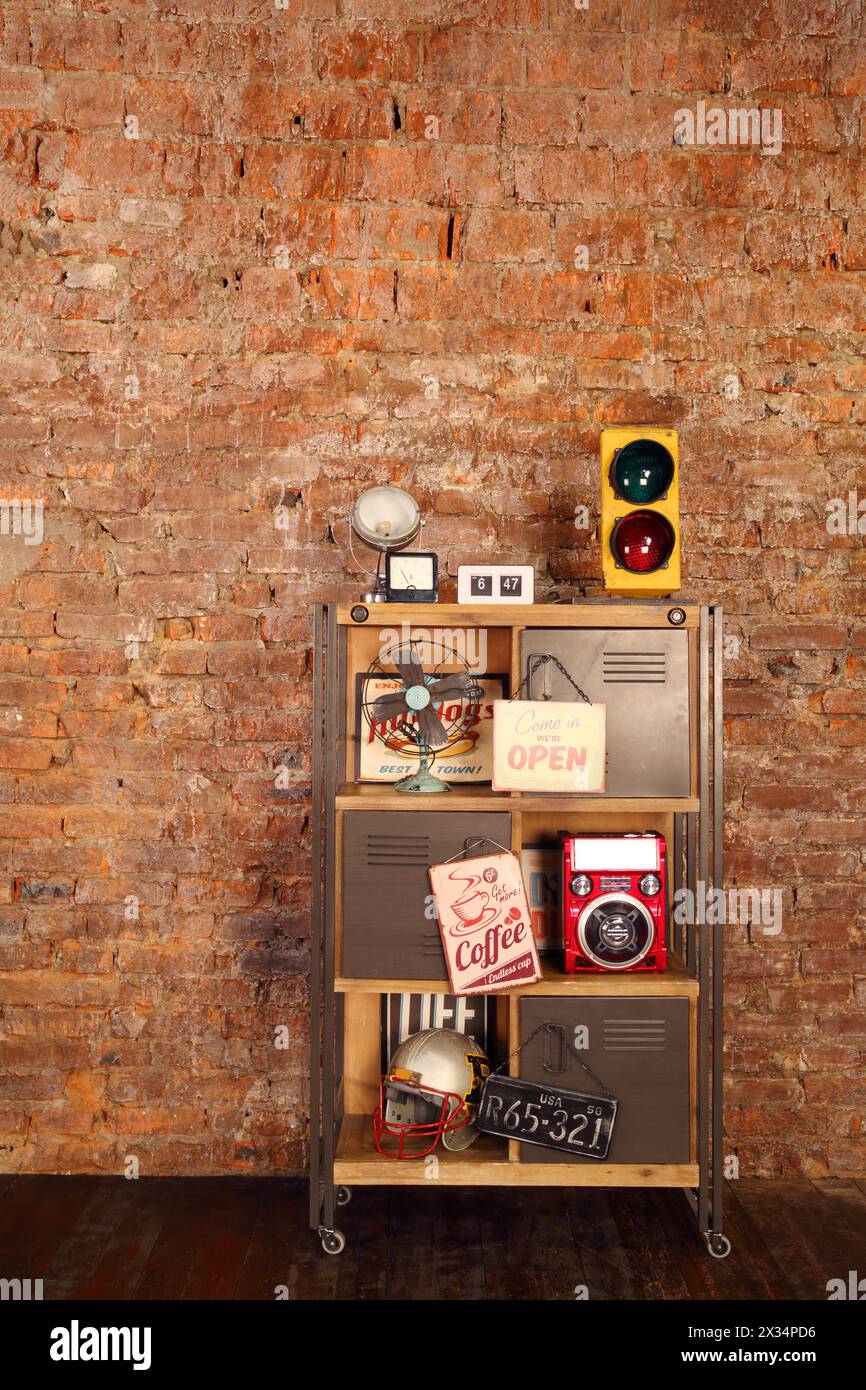 Retro studio with brick wall, shelves with radio, fan, helmet Stock ...