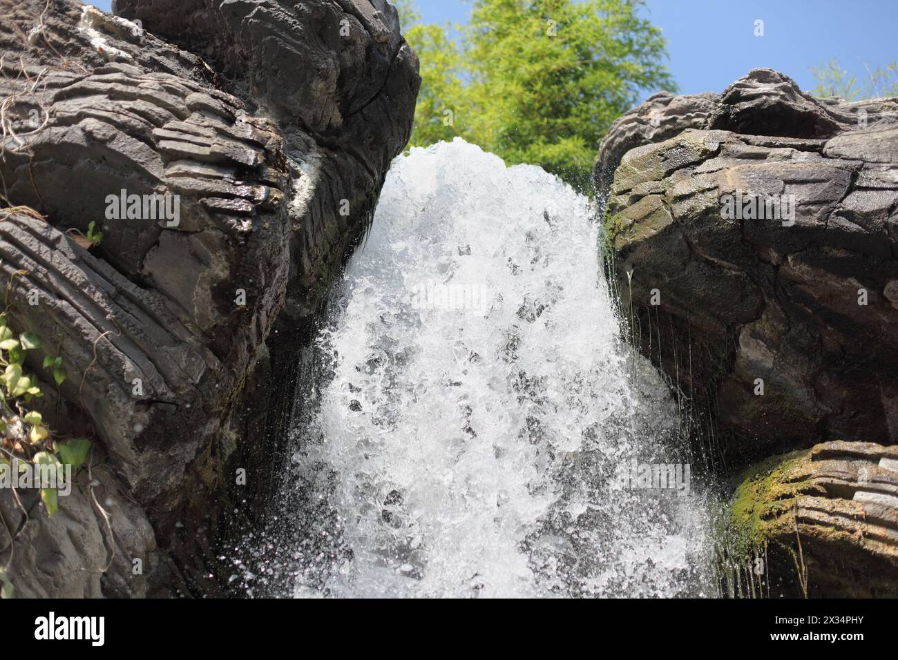 Waterfall on the rock is the decoration at amusement park Stock Photo ...