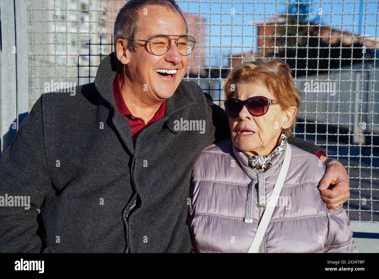 family scene with a mother and her son laughing and talking. Real and ...