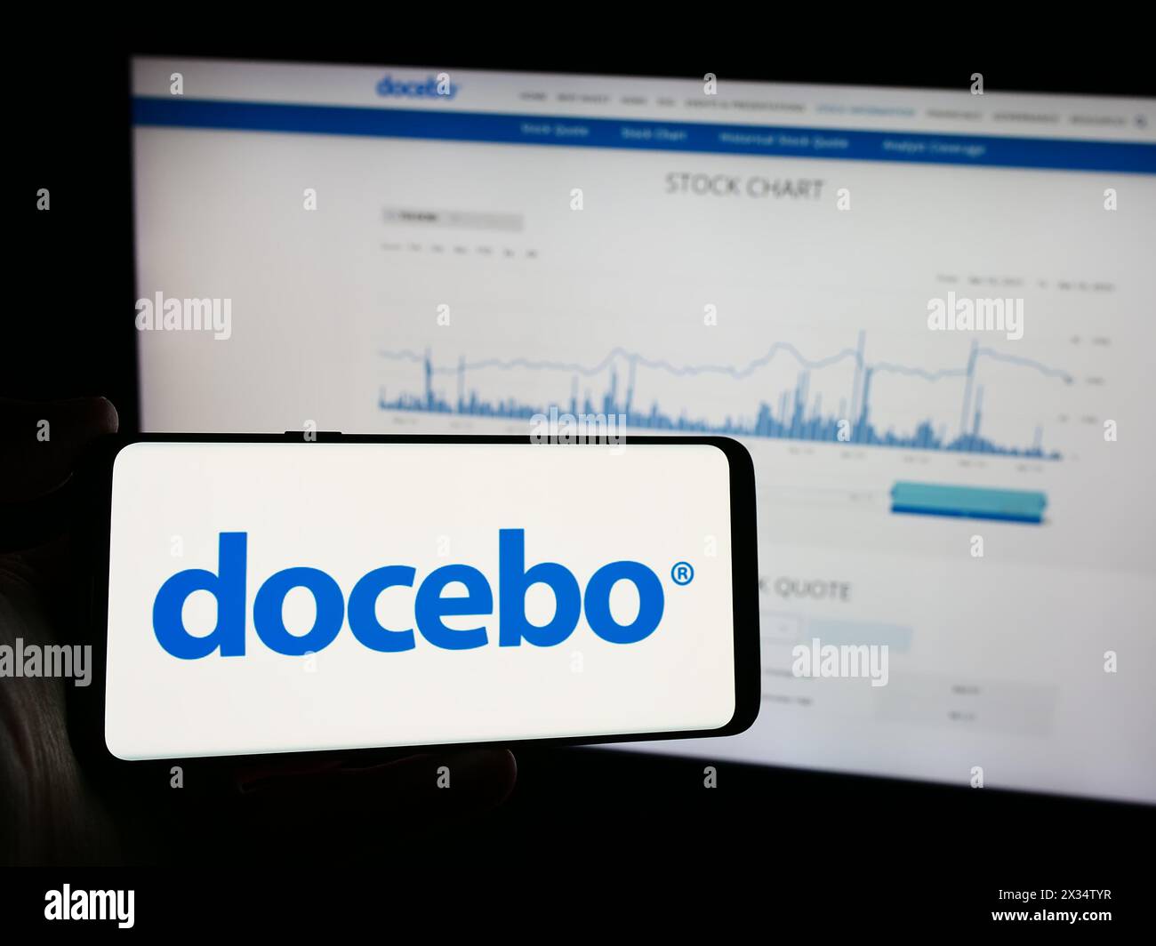 Person holding mobile phone with logo of Canadian learning software ...