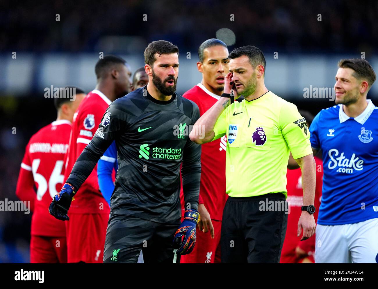 Liverpool goalkeeper Alisson Becker appeals to referee Andrew Madley ...