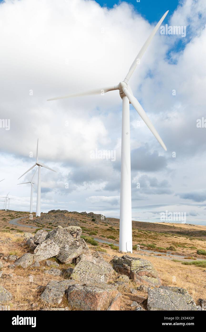 various mountain wind turbine with green grass and cloudy sky Stock ...
