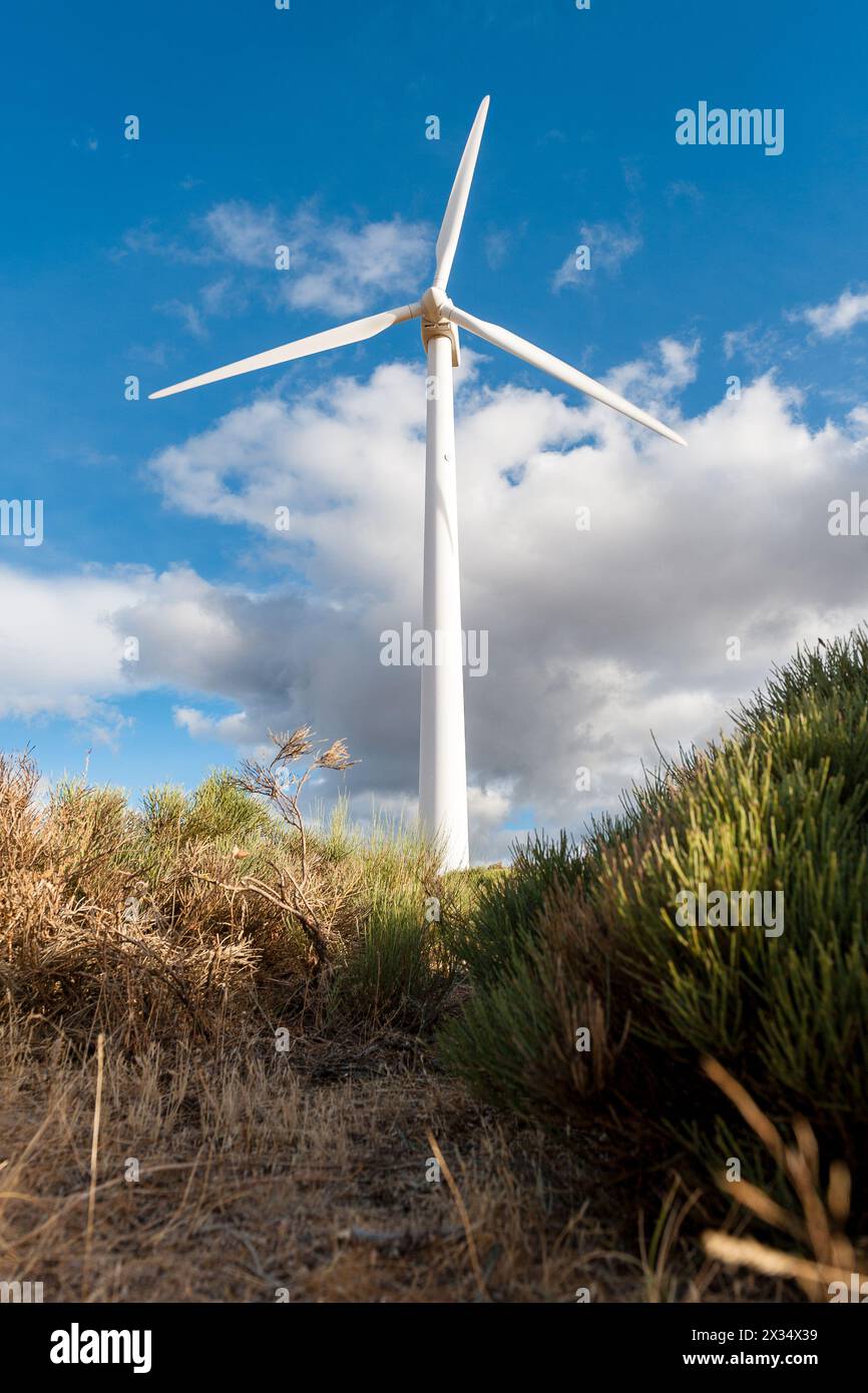 various mountain wind turbine with green grass and cloudy sky Stock ...