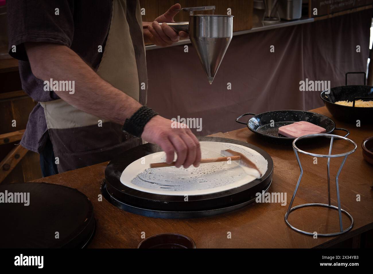Artisan Baker working in the bakery in the crepes preparations Stock ...