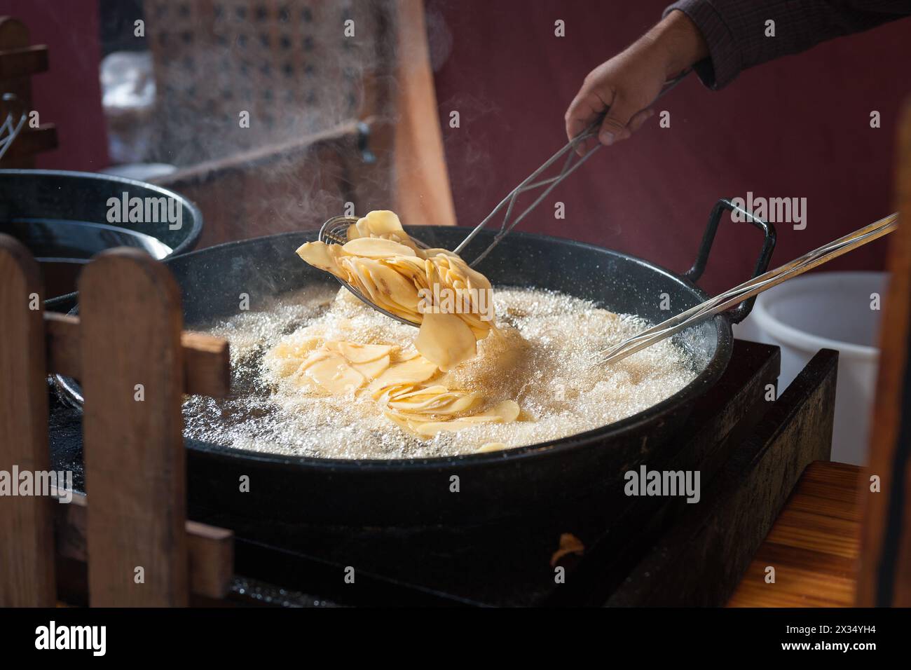 Fast food being cooked in vegetable oil in large fryer Stock Photo - Alamy