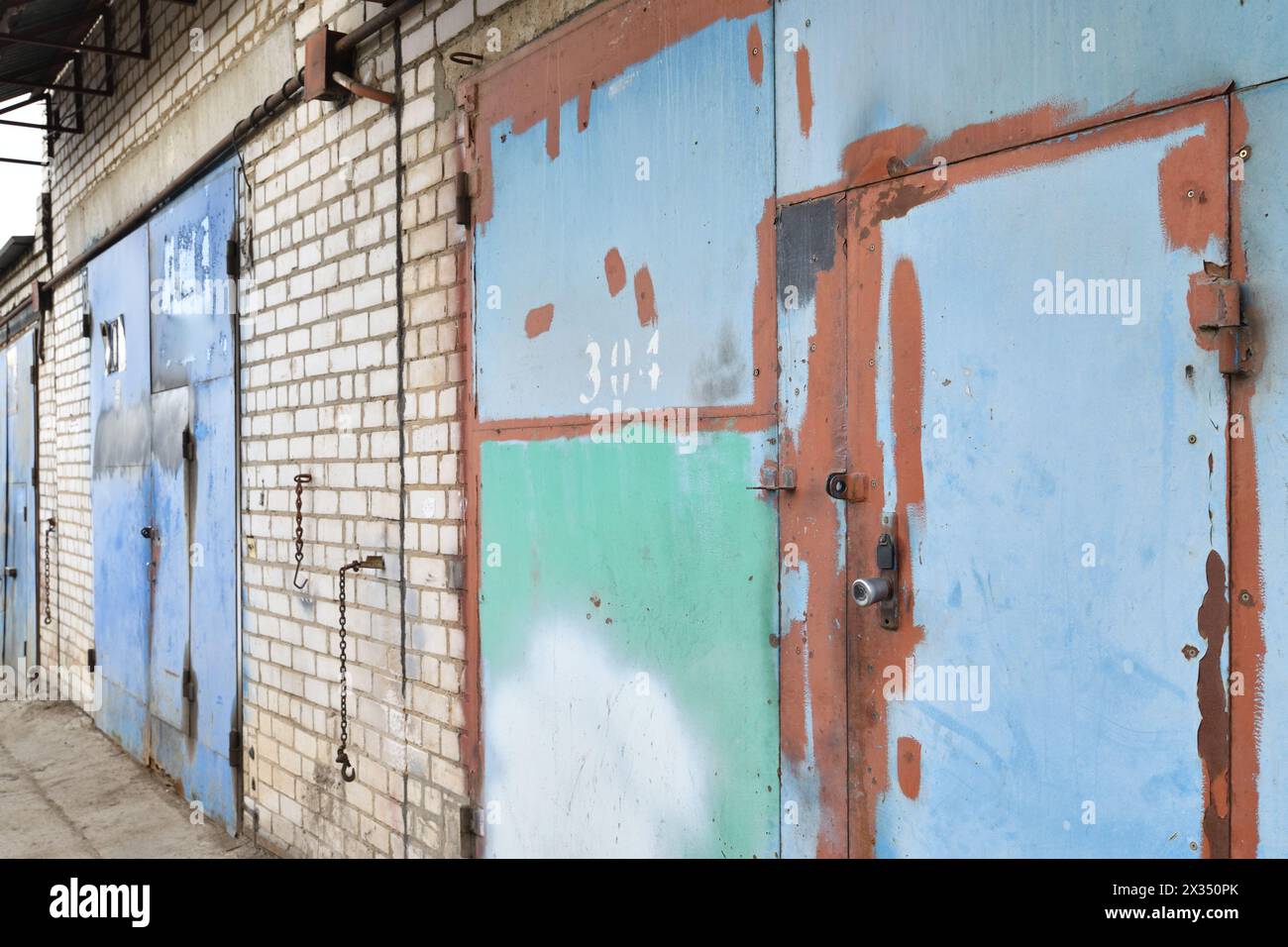 Brick garages with a metal gates of garage cooperative in Russia Stock ...