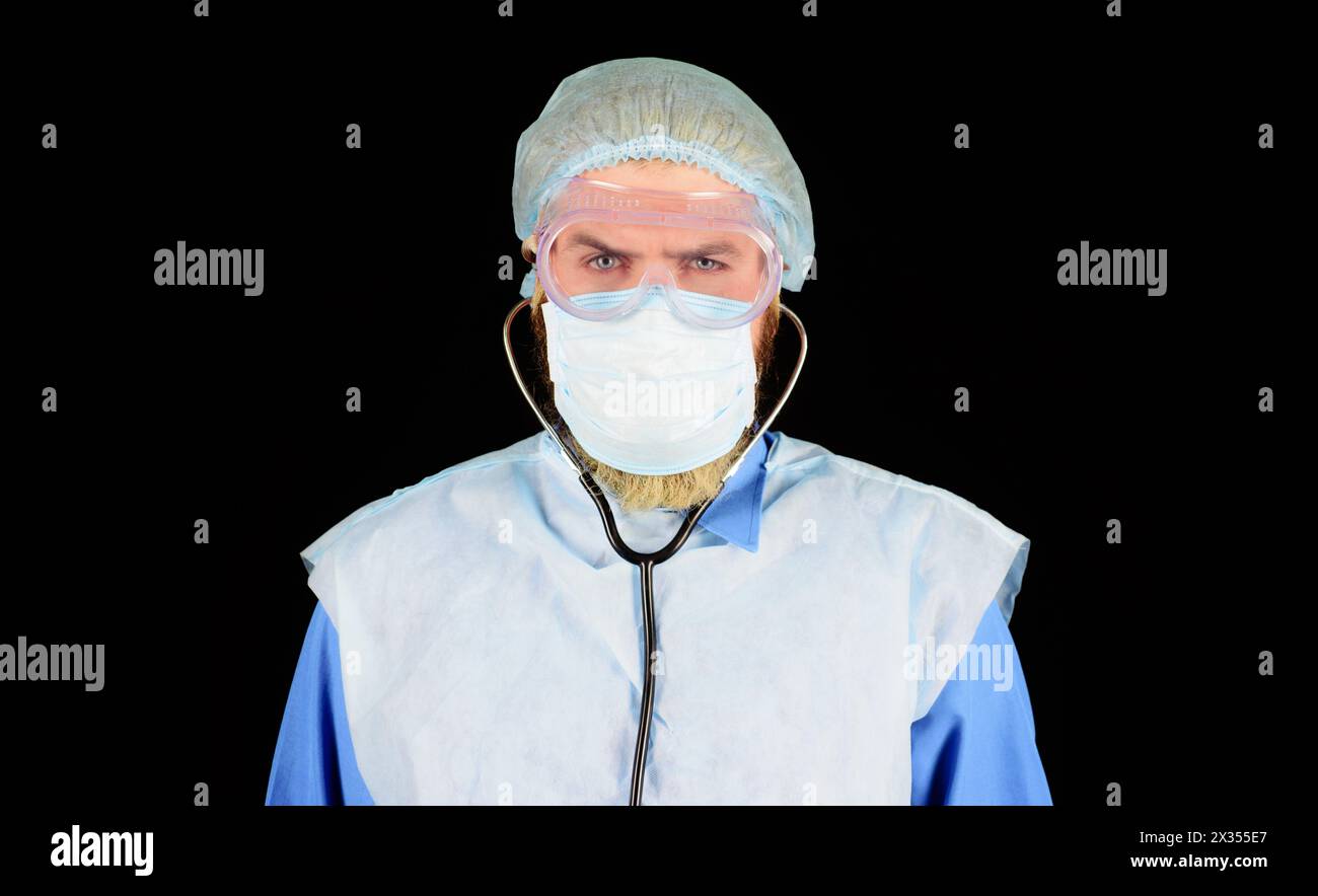 Hospital worker. Serious doctor in medical uniform, mask, protective ...
