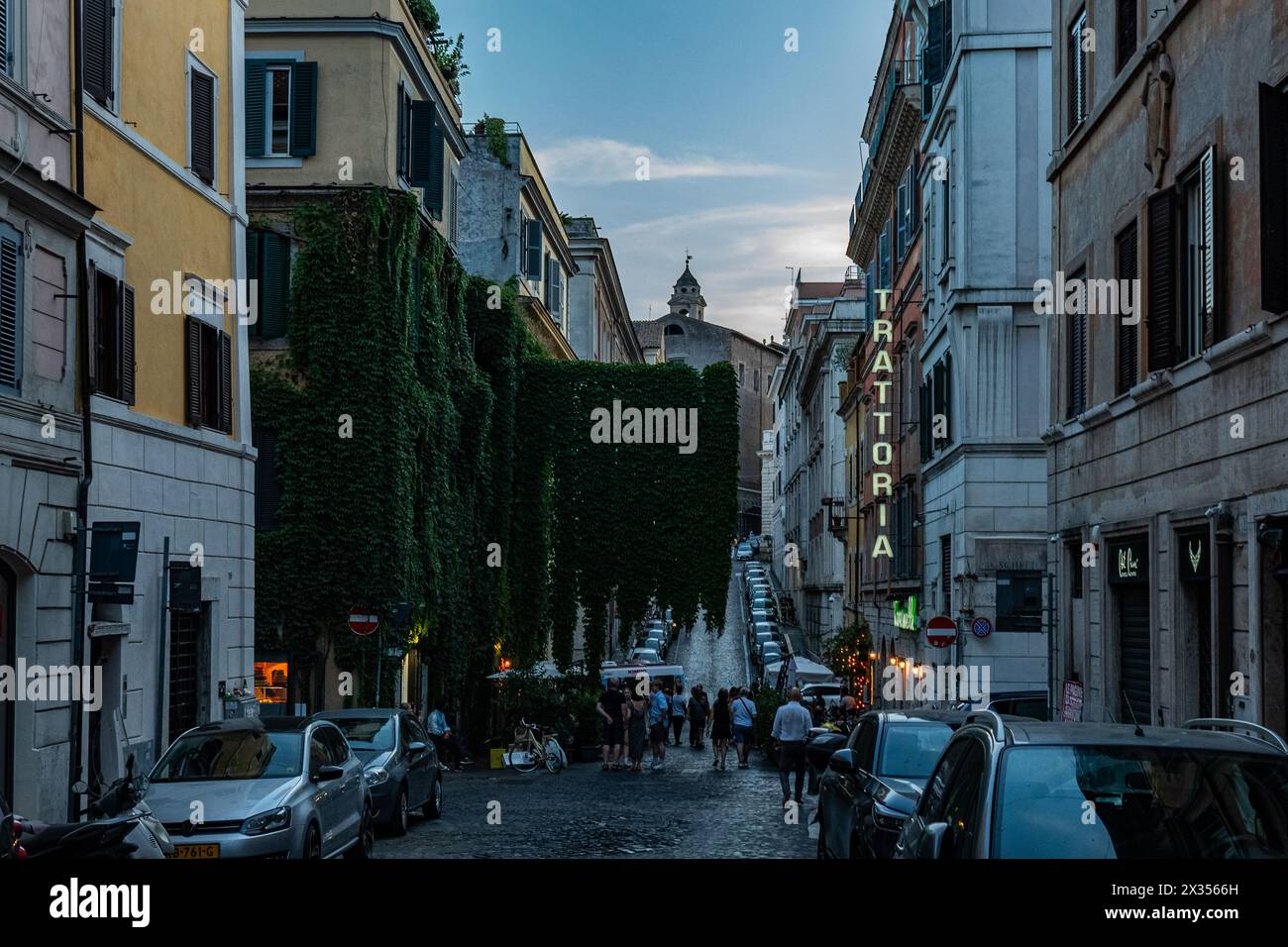 Rome, Italy - July 13 2023: View of cobblestone road with parked cars ...
