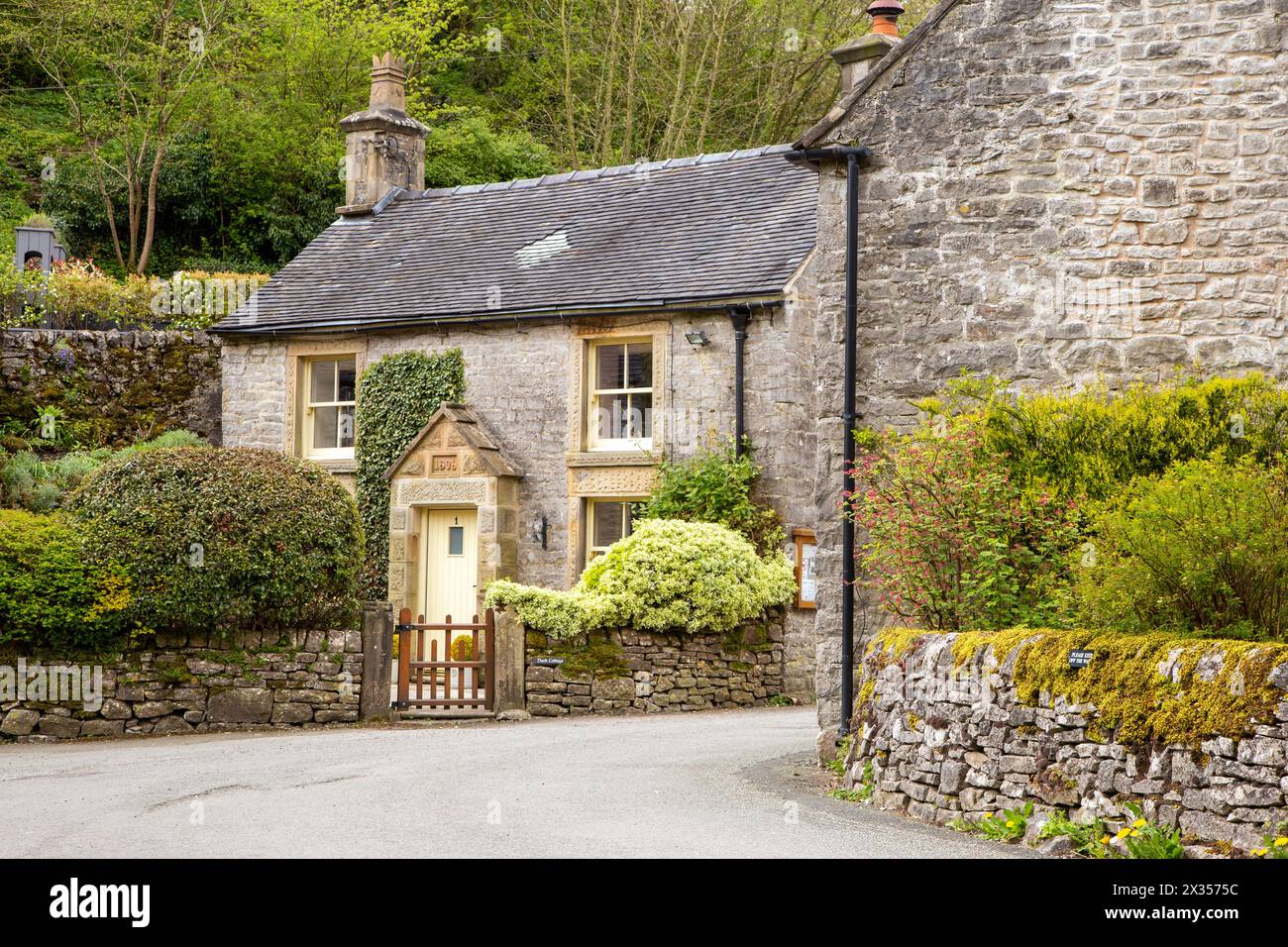 Stone built cottage and gardens in the Derbyshire Peak District village ...