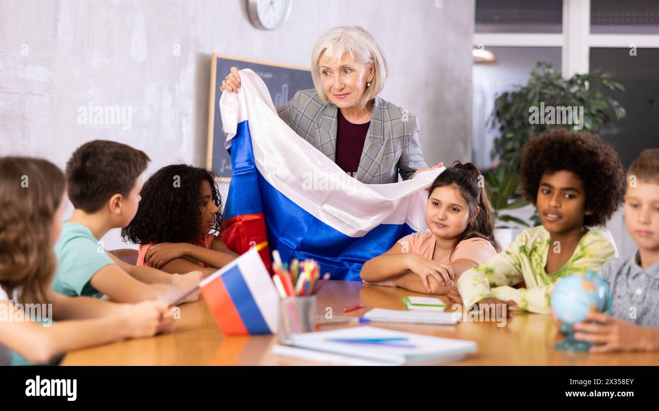 Mature woman teacher tells hi-res stock photography and images - Alamy