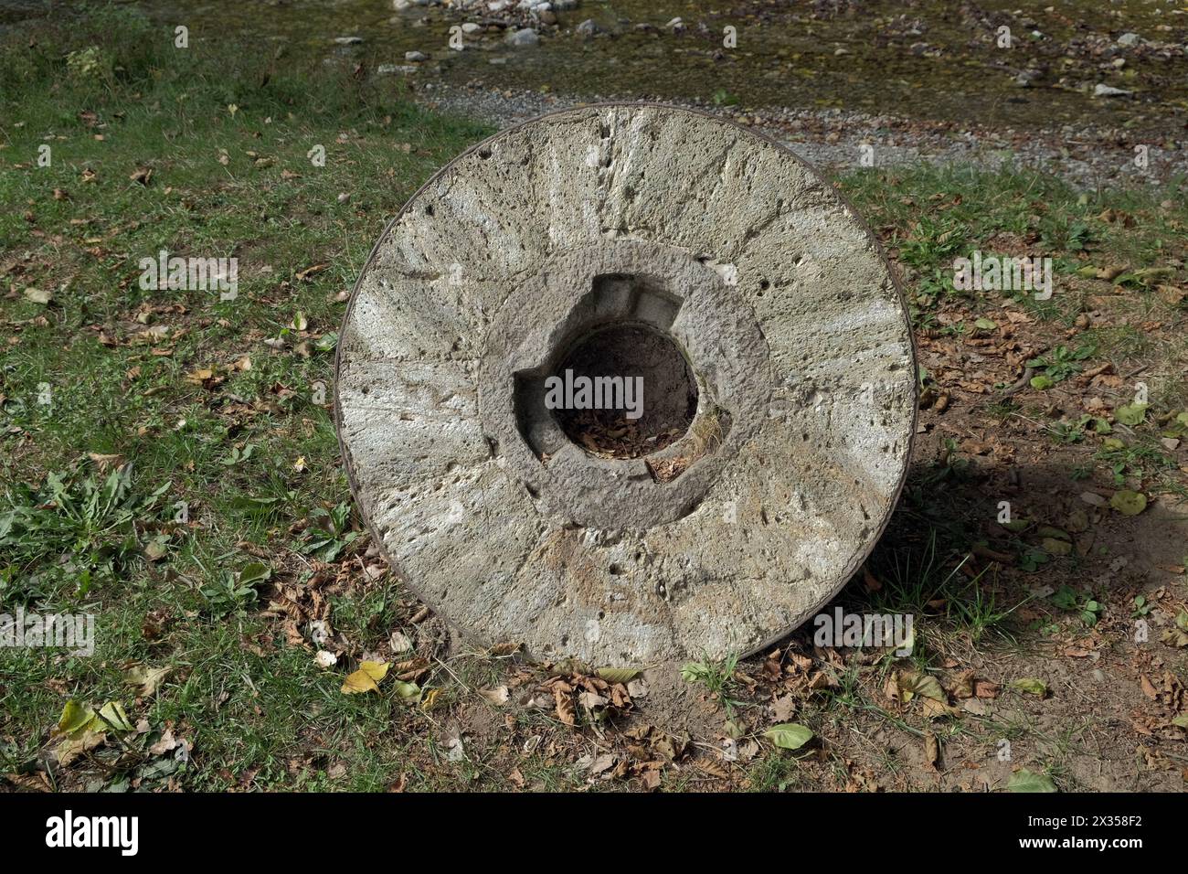 old millstone along the footpath to the spring of Gradac River, Serbia ...