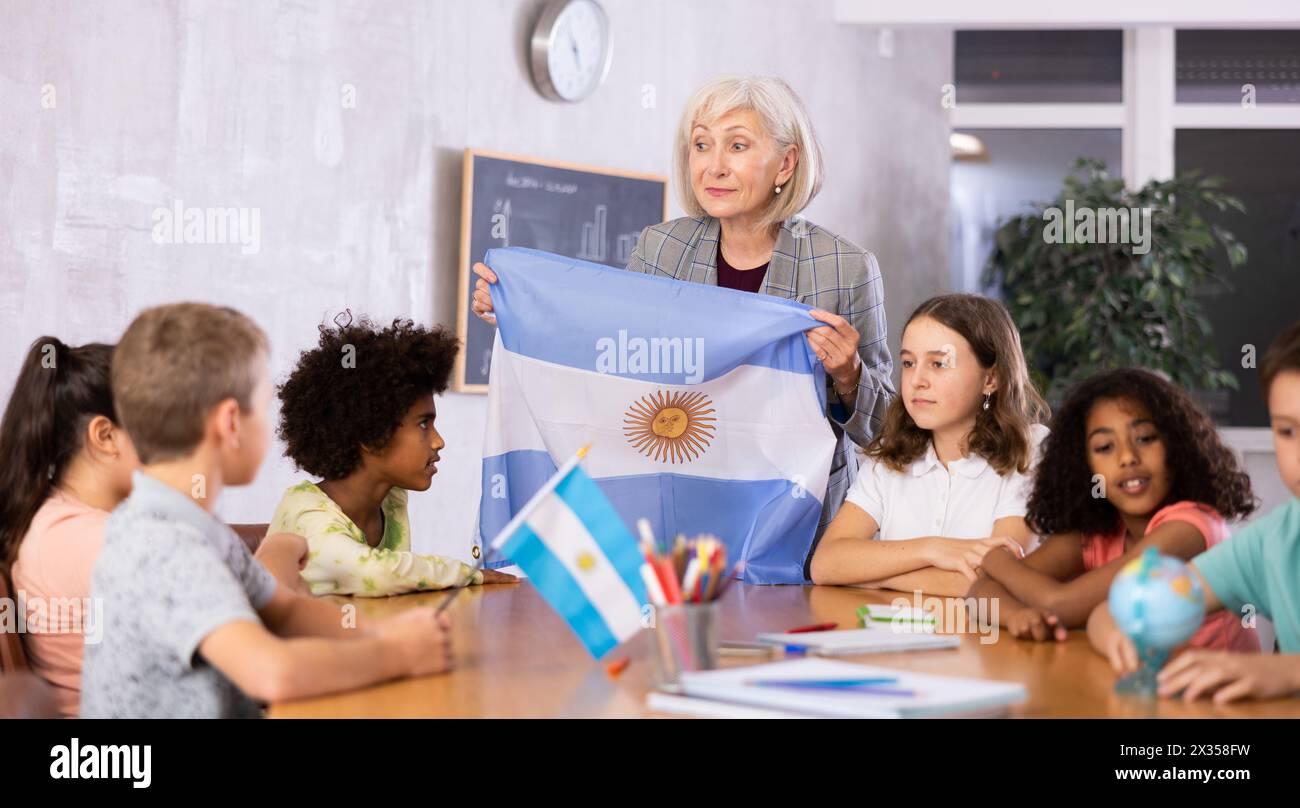 Mature woman teacher tells hi-res stock photography and images - Alamy