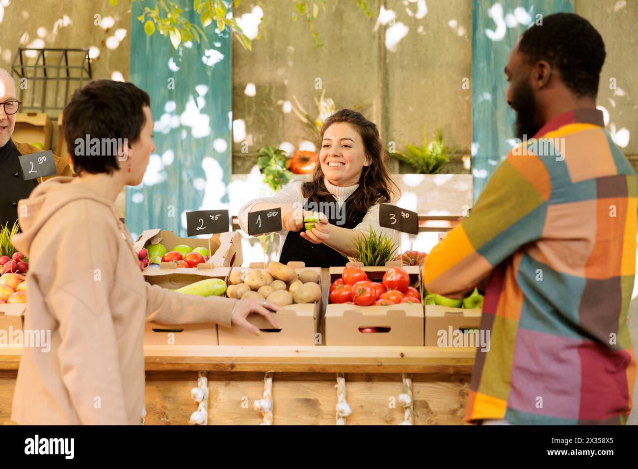 Boyfriend and girlfriend tasting fresh green apple before purchasing ...