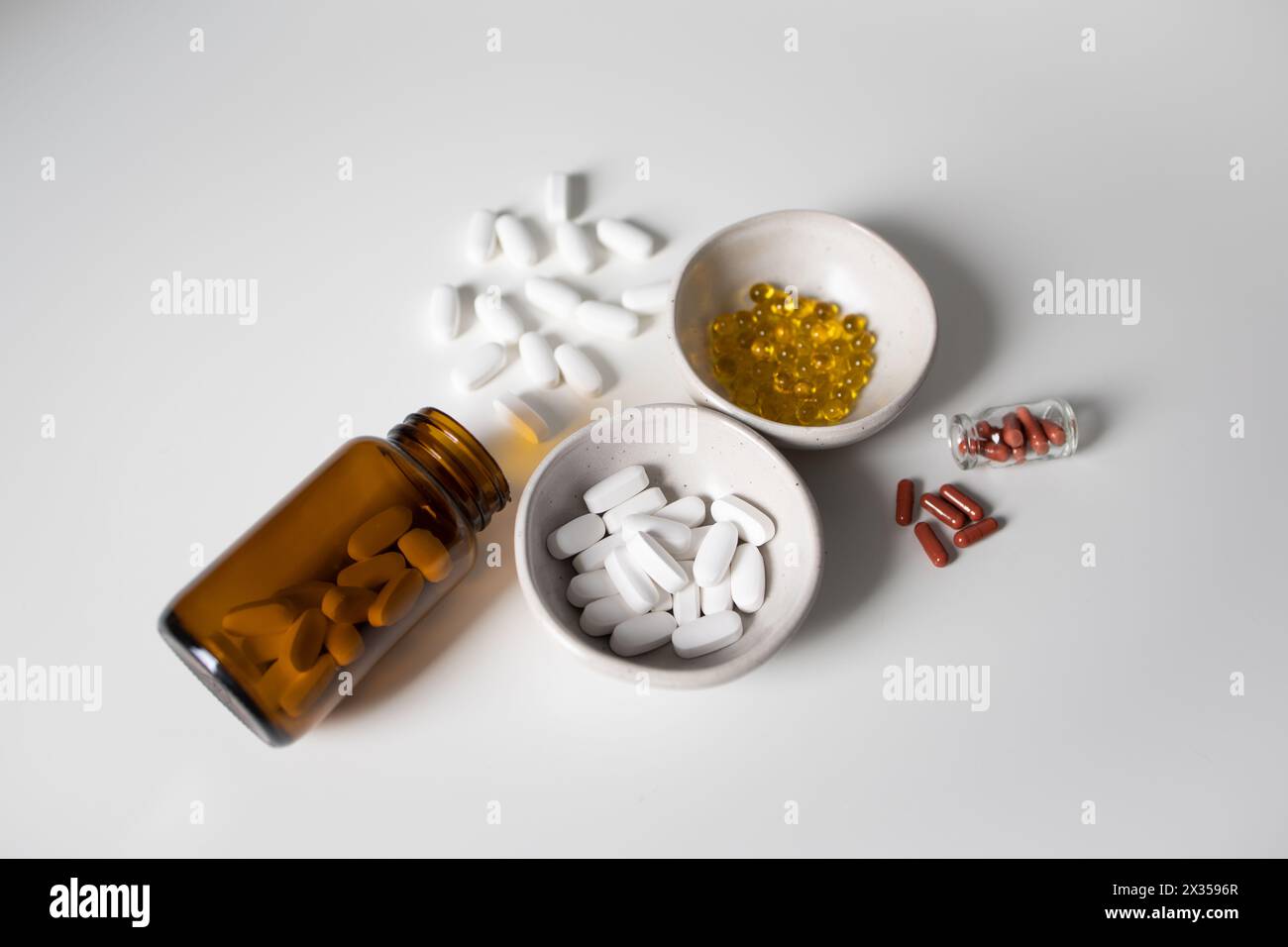 Many different pills and capsules on white background Stock Photo - Alamy