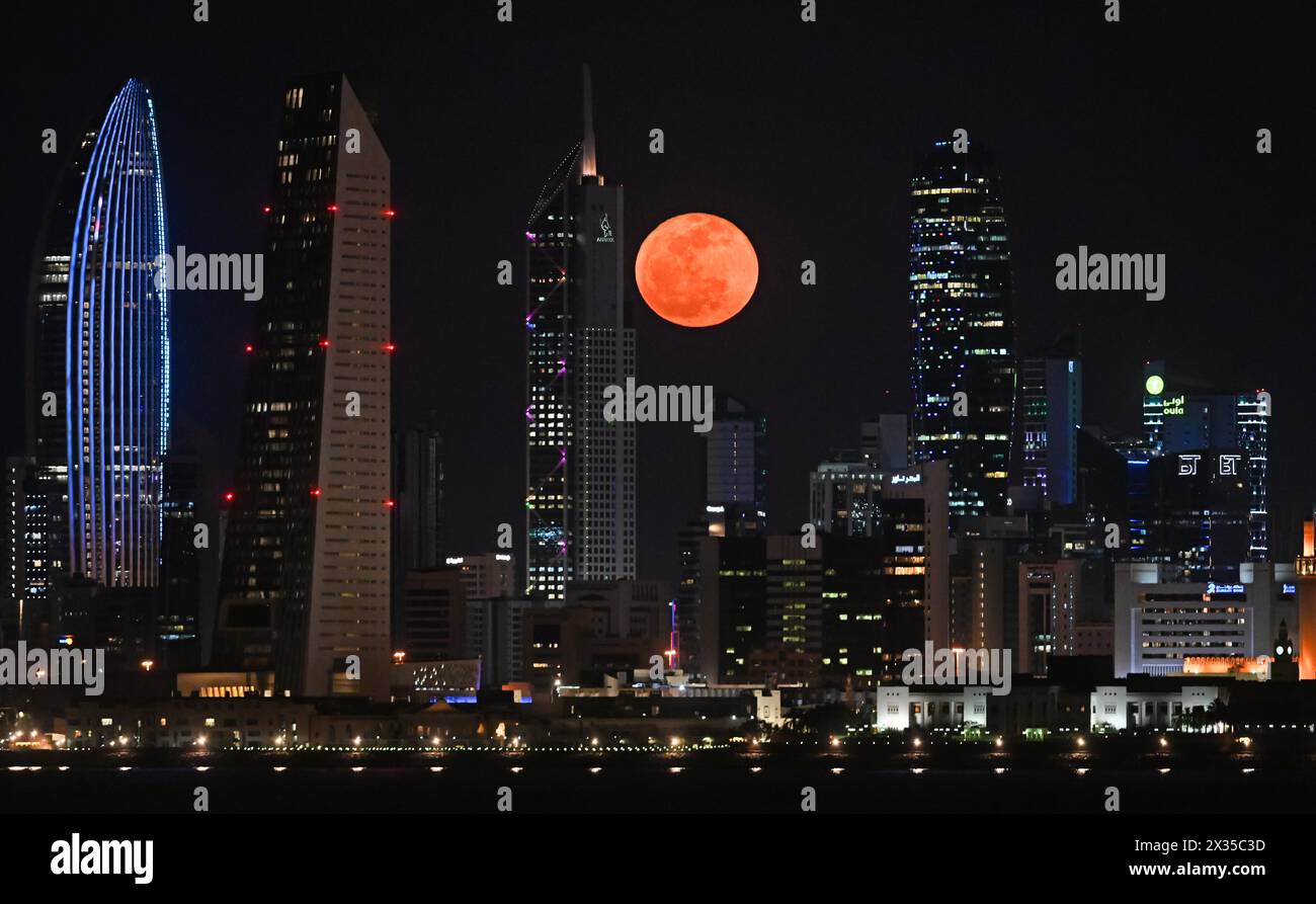 Kuwait City, Kuwait. 24th Apr, 2024. The moon rises behind the skyline ...